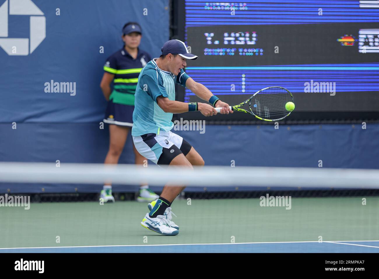 Yu Hsiou Hsu in action during a men's singles match at the 2023 US Open ...