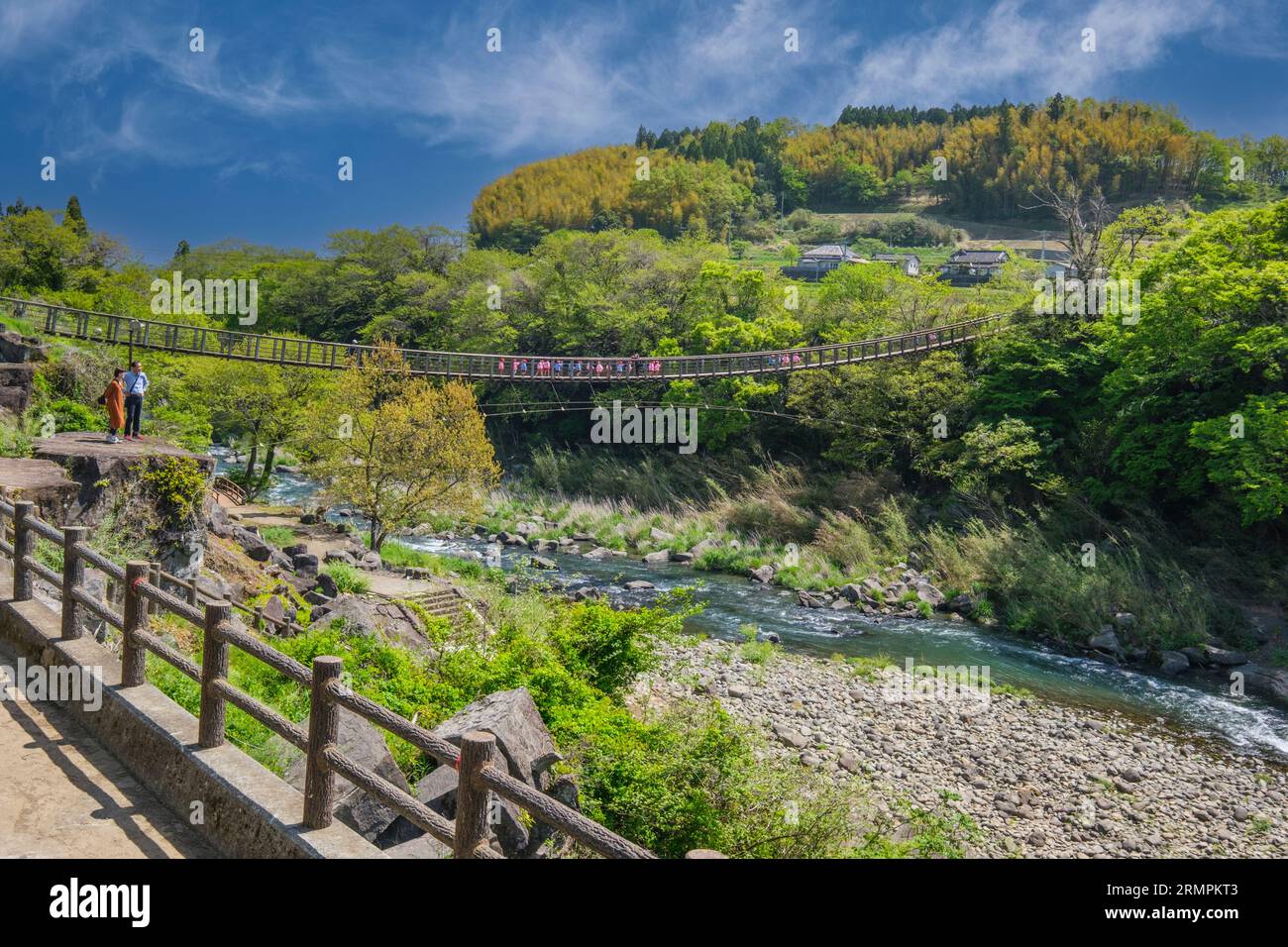 Japan, Kyushu. Pedestrian Suspension Bridge over Stream at Harajiri ...
