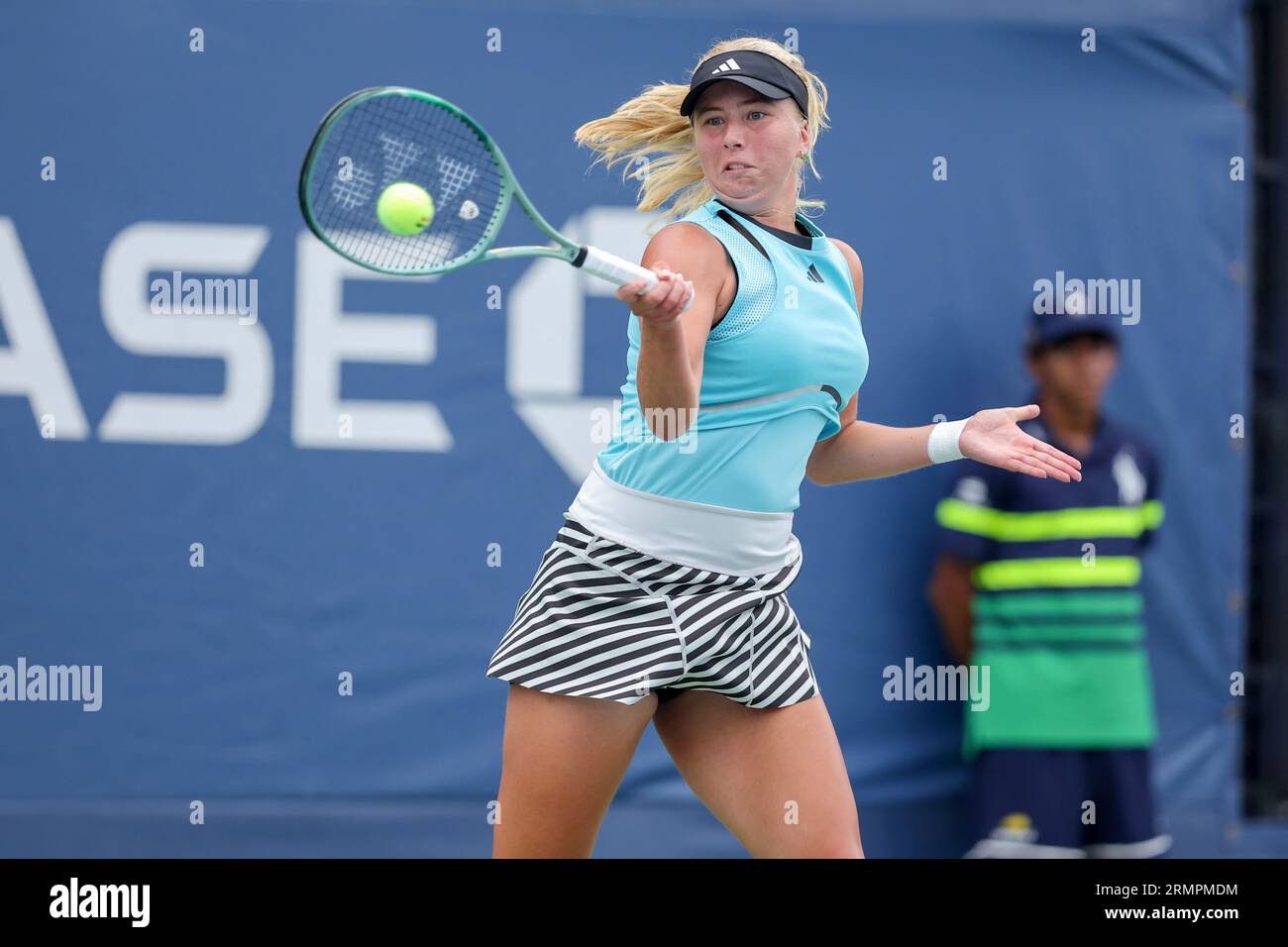 Clara Tauson in action during a women's singles match at the 2023 US ...