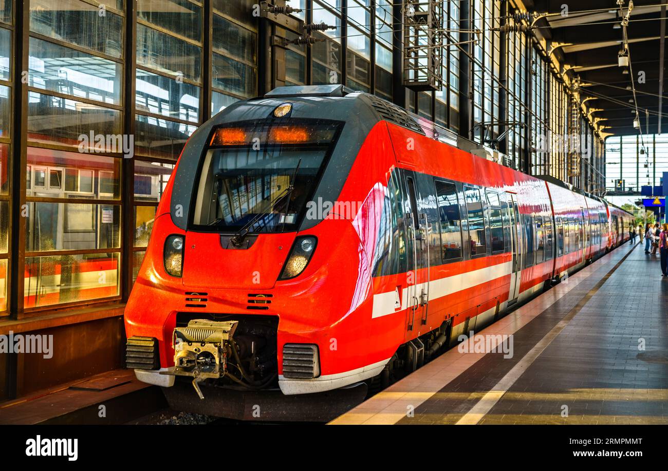 Red regional train at Zoologischer Garten Station in Berlin, Germany ...