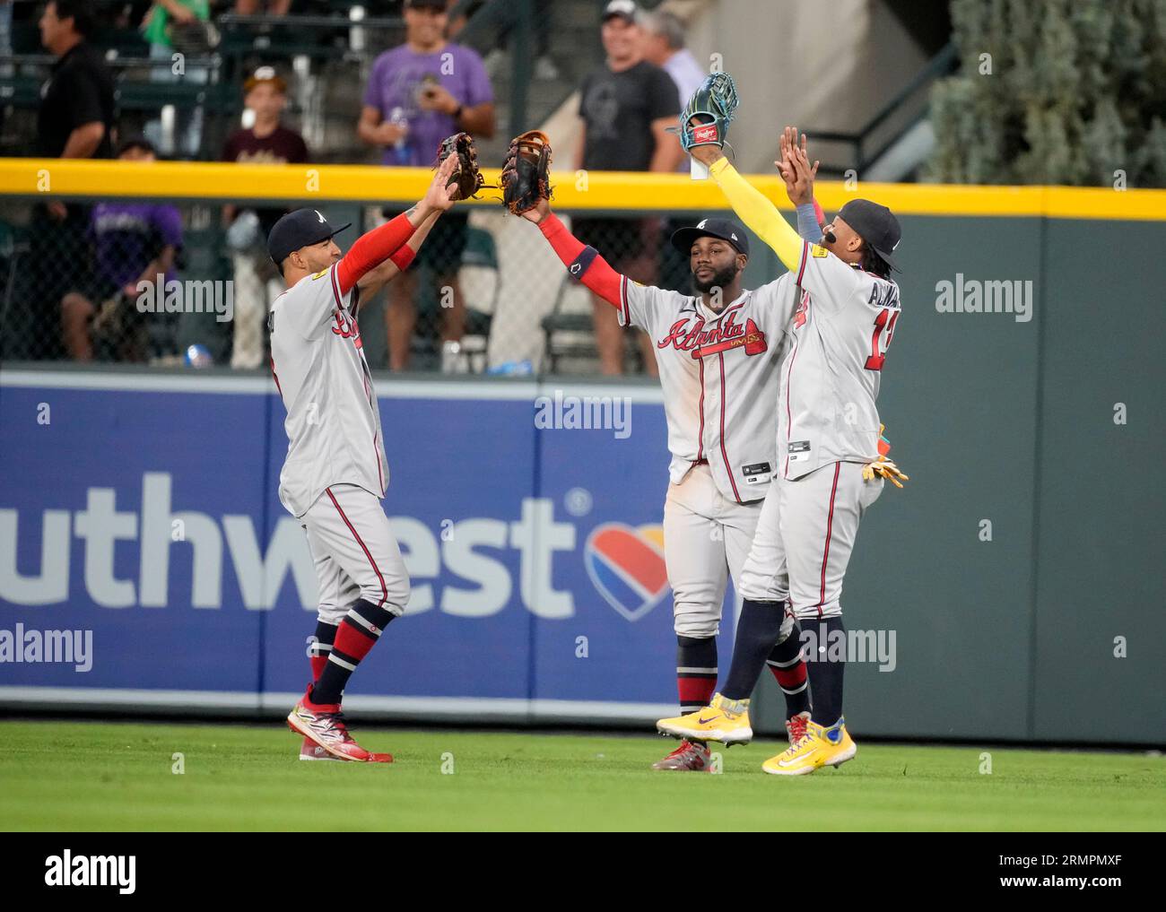 Atlanta Braves left fielder Eddie Rosario, center fielder Michael ...