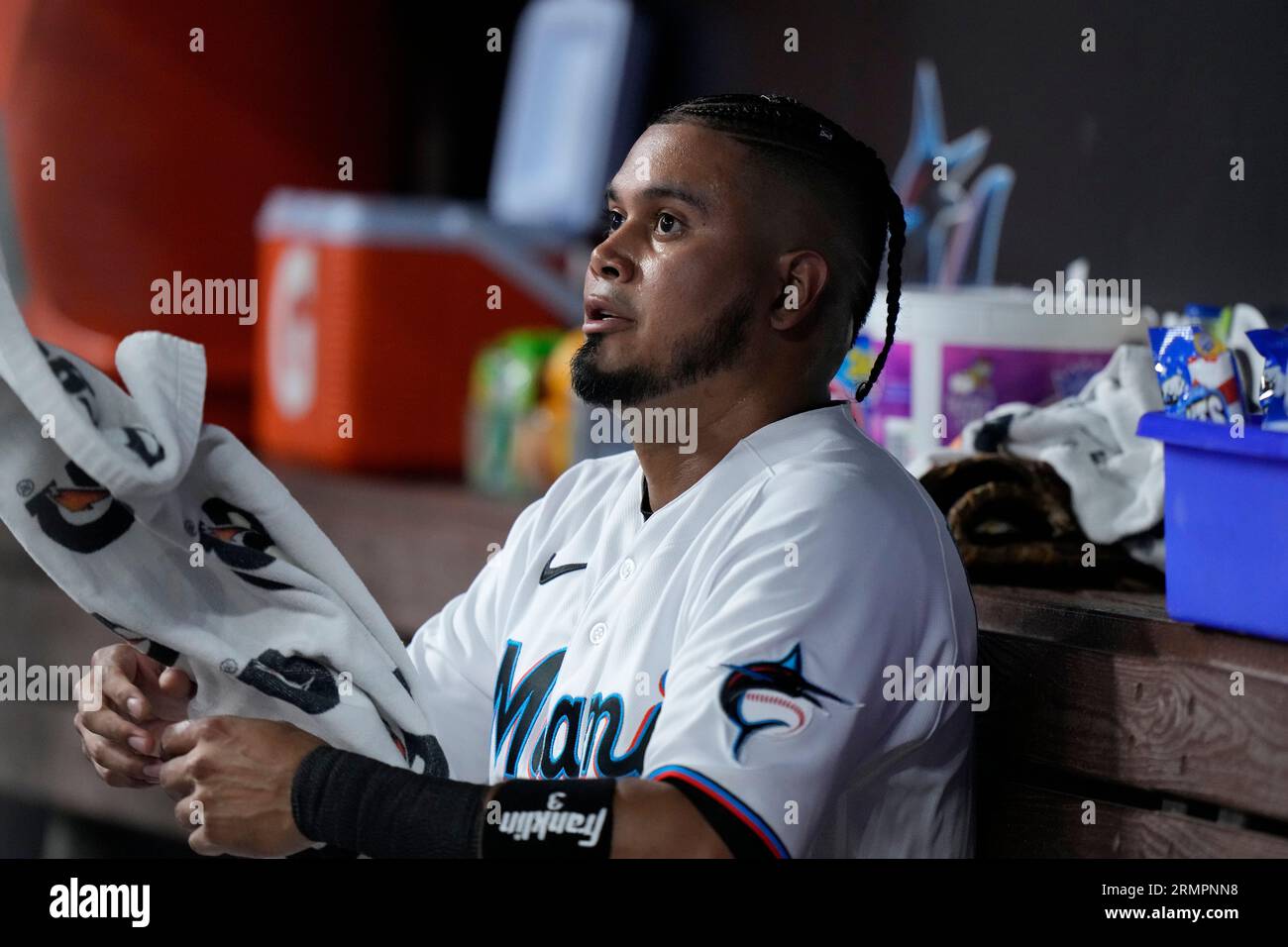 Miami Marlins second baseman Luis Arraez sits in the dugout during the ...