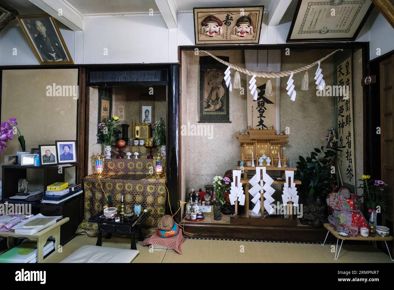 Japan, Kyushu. Buddhist Ancestral Family Altar (Butsudan) on left ...