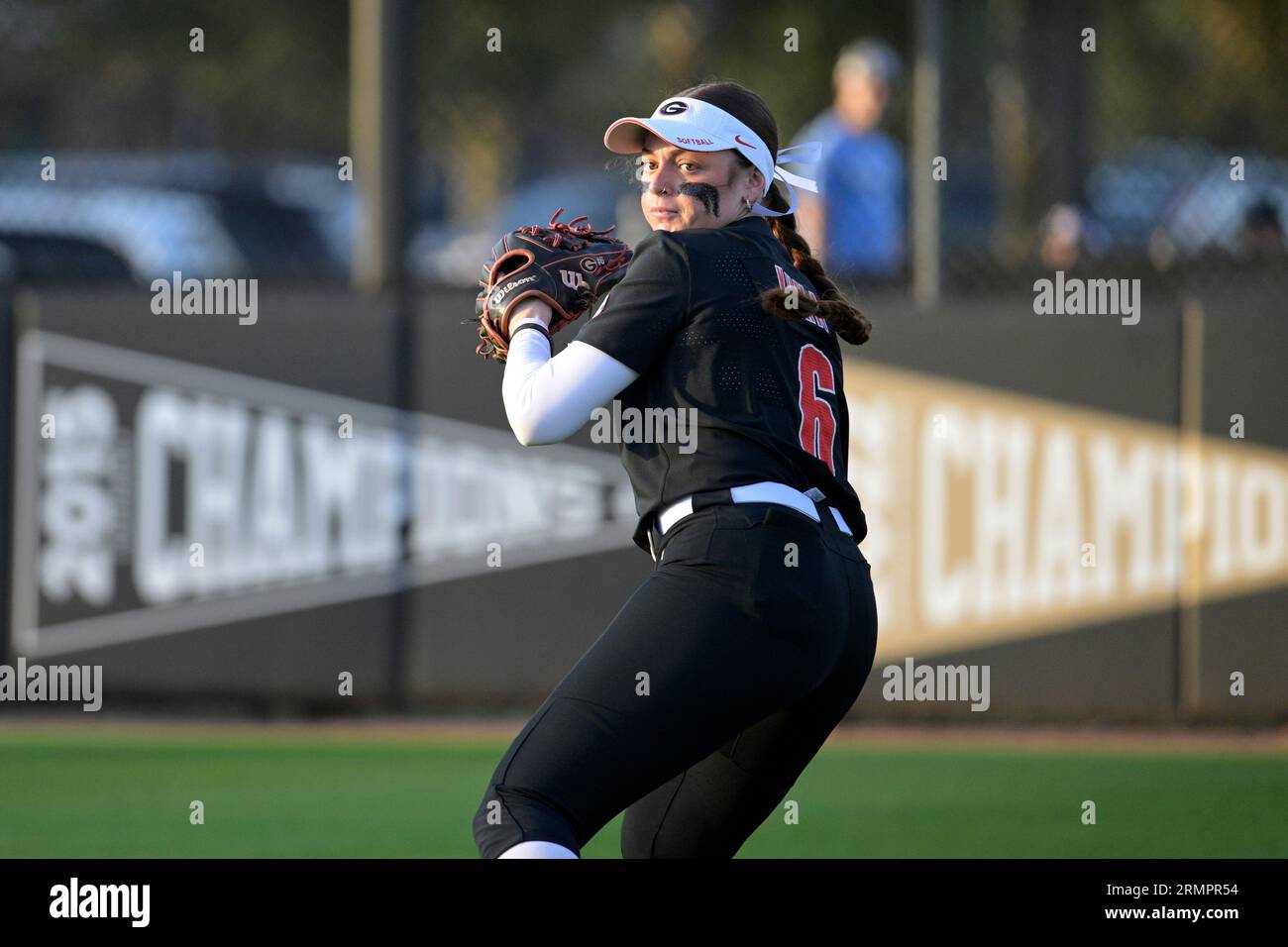 Georgia's Sydney Kuma (6) warms up before an NCAA college softball game ...