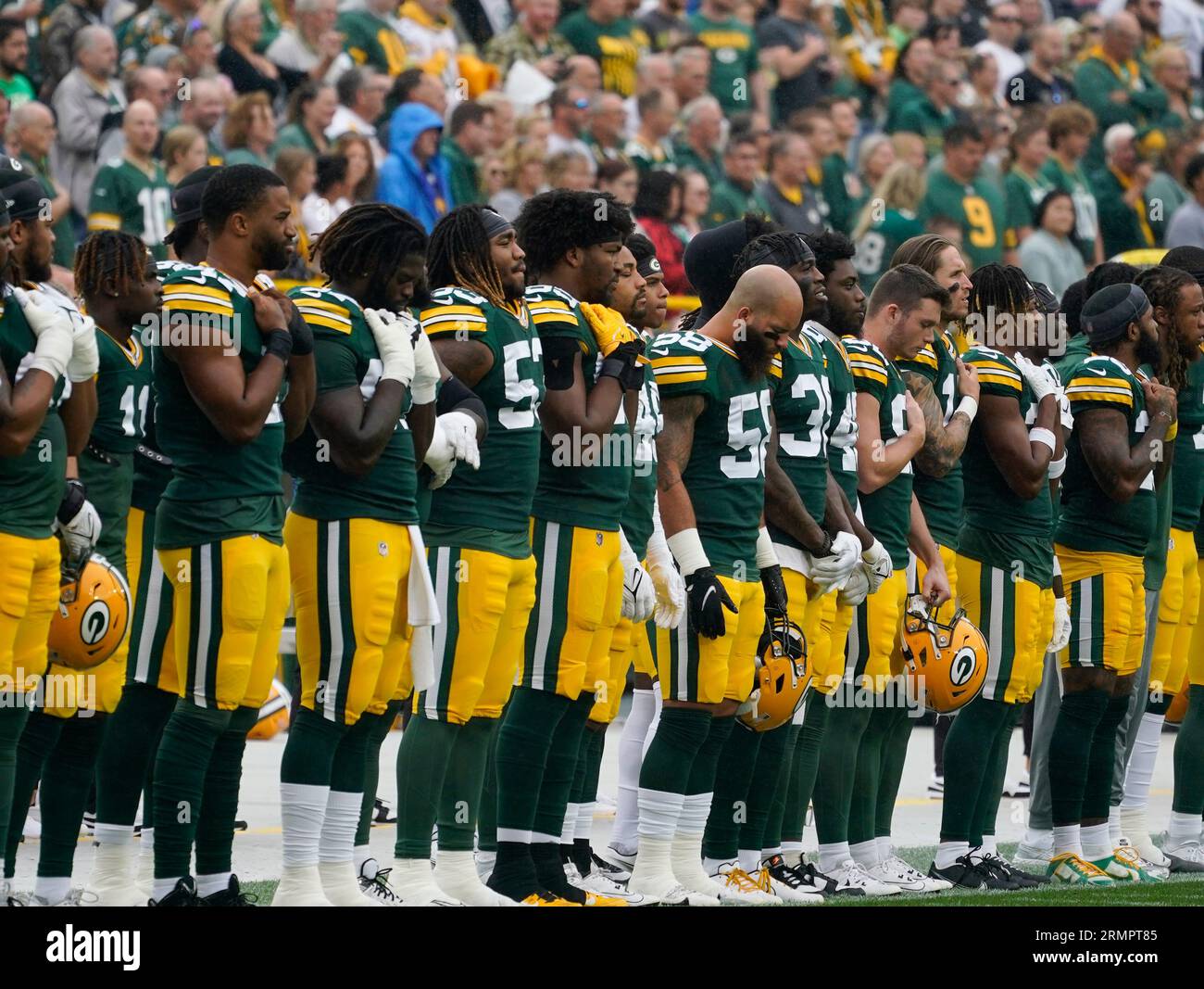 Green Bay Packers players line up for the national anthem before a ...