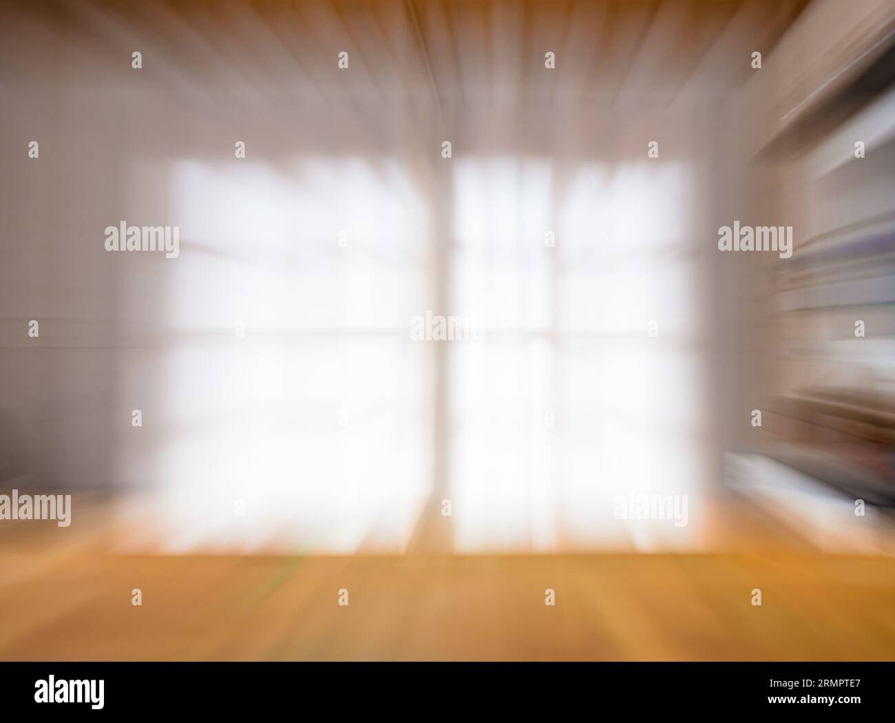 A window with a sheer white curtain out of focus, creating an abstract ...