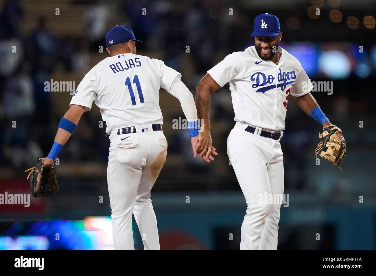 Los Angeles Dodgers' shortstop Miguel Rojas (11) and second baseman ...