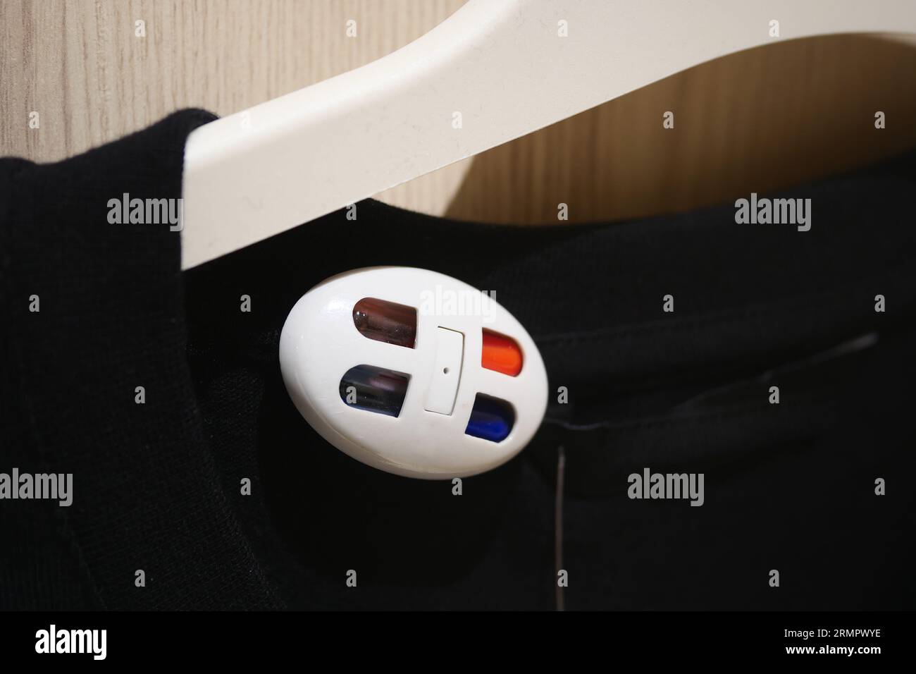 Security tags on clothes hi-res stock photography and images - Alamy