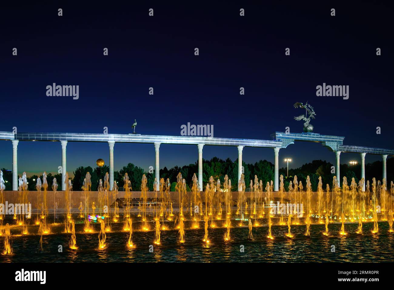 Memorial and rows of fountains with night illumination in the ...