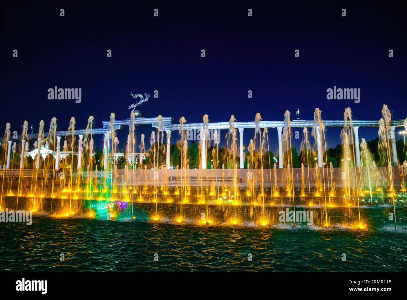 Memorial and rows of fountains with night illumination in the ...