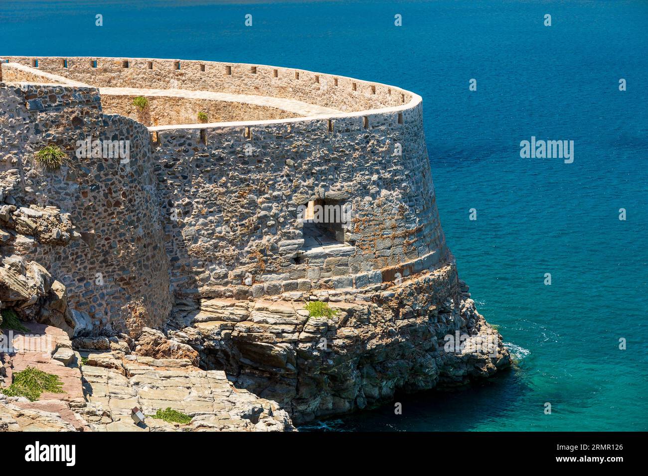 The ruins of an ancient Venetian fortress overlooking crystal clear ...