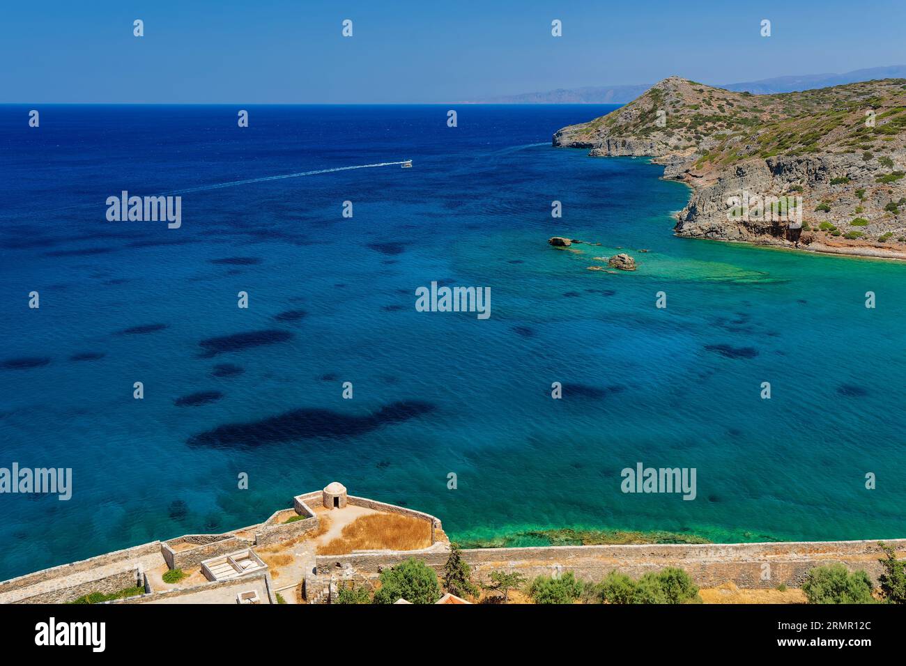 The ruins of an ancient Venetian fortress overlooking crystal clear ...
