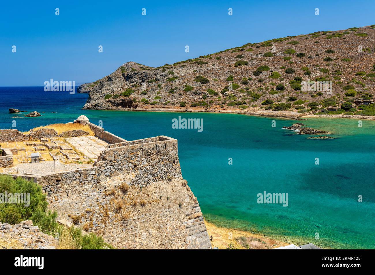 The ruins of an ancient Venetian fortress overlooking crystal clear ...