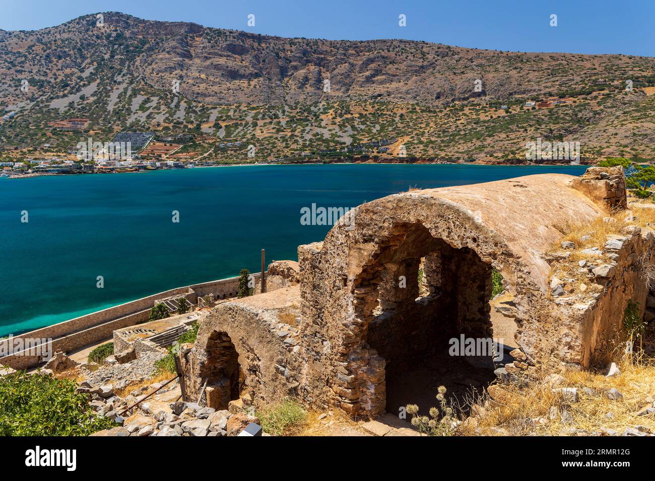 The ruins of an ancient Venetian fortress overlooking crystal clear ...