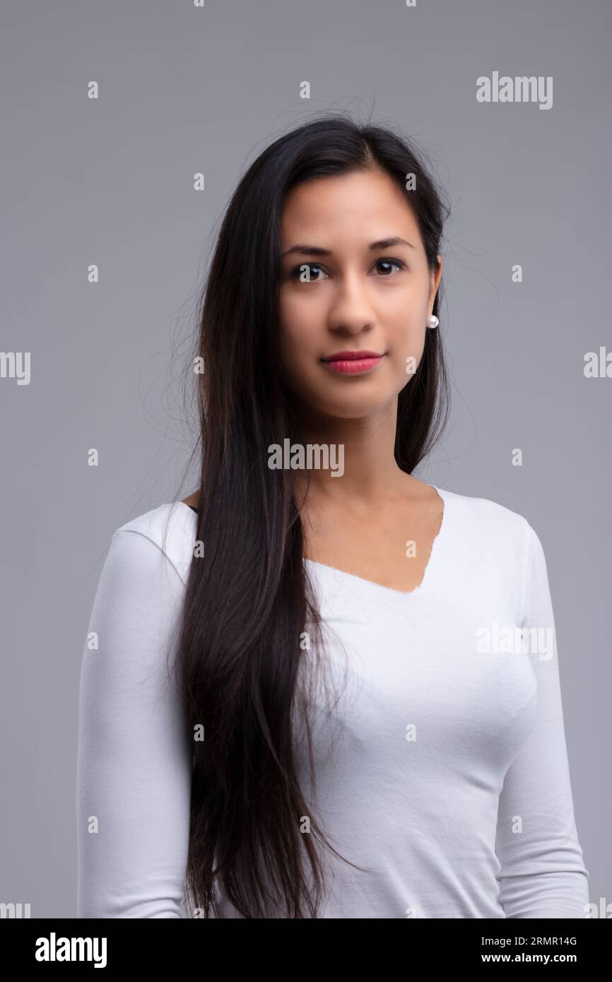 Attractive Dark Haired Woman Wearing Pearl Earrings And A White Lacy