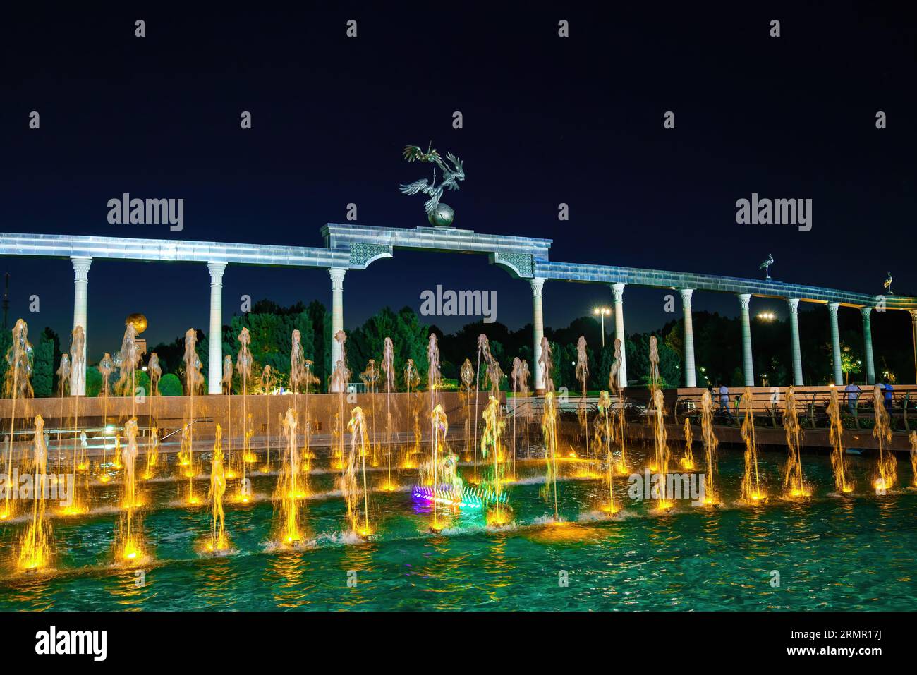 Memorial and rows of fountains with night illumination in the ...