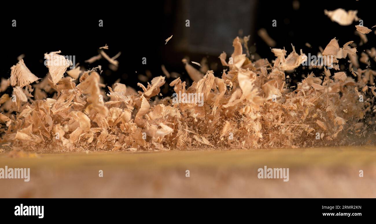 Wood Chips Falling on a Board Stock Photo - Alamy