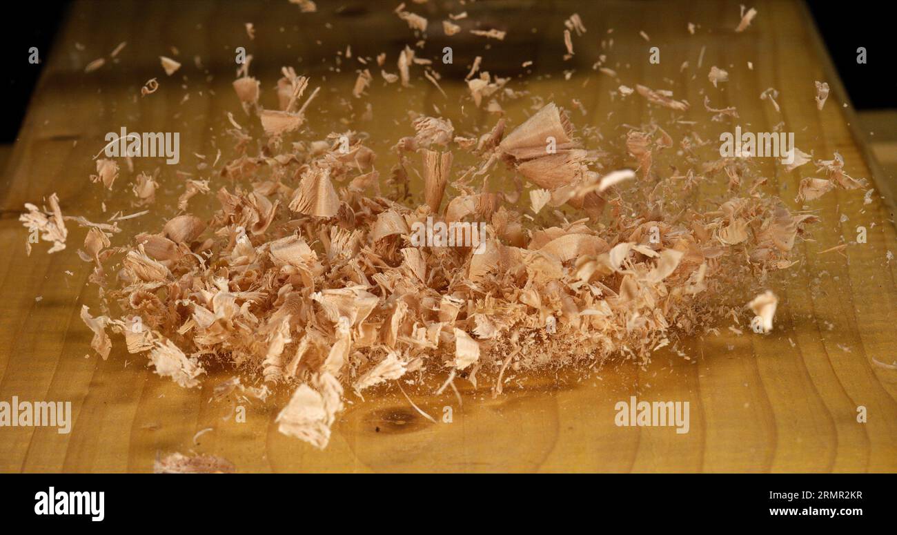 Wood chips falling on board hi-res stock photography and images - Alamy