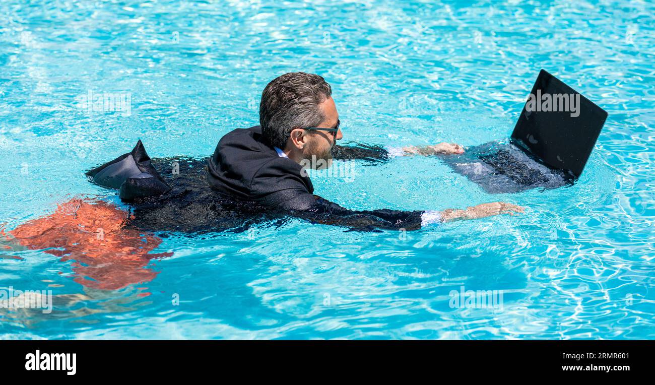 business man on summer vacation. businessman in wet suit in swim pool ...