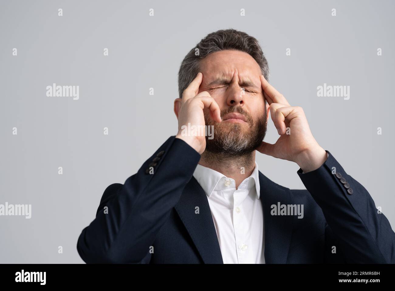 Businessman in suit with headache. Businessman with stress and burnout ...