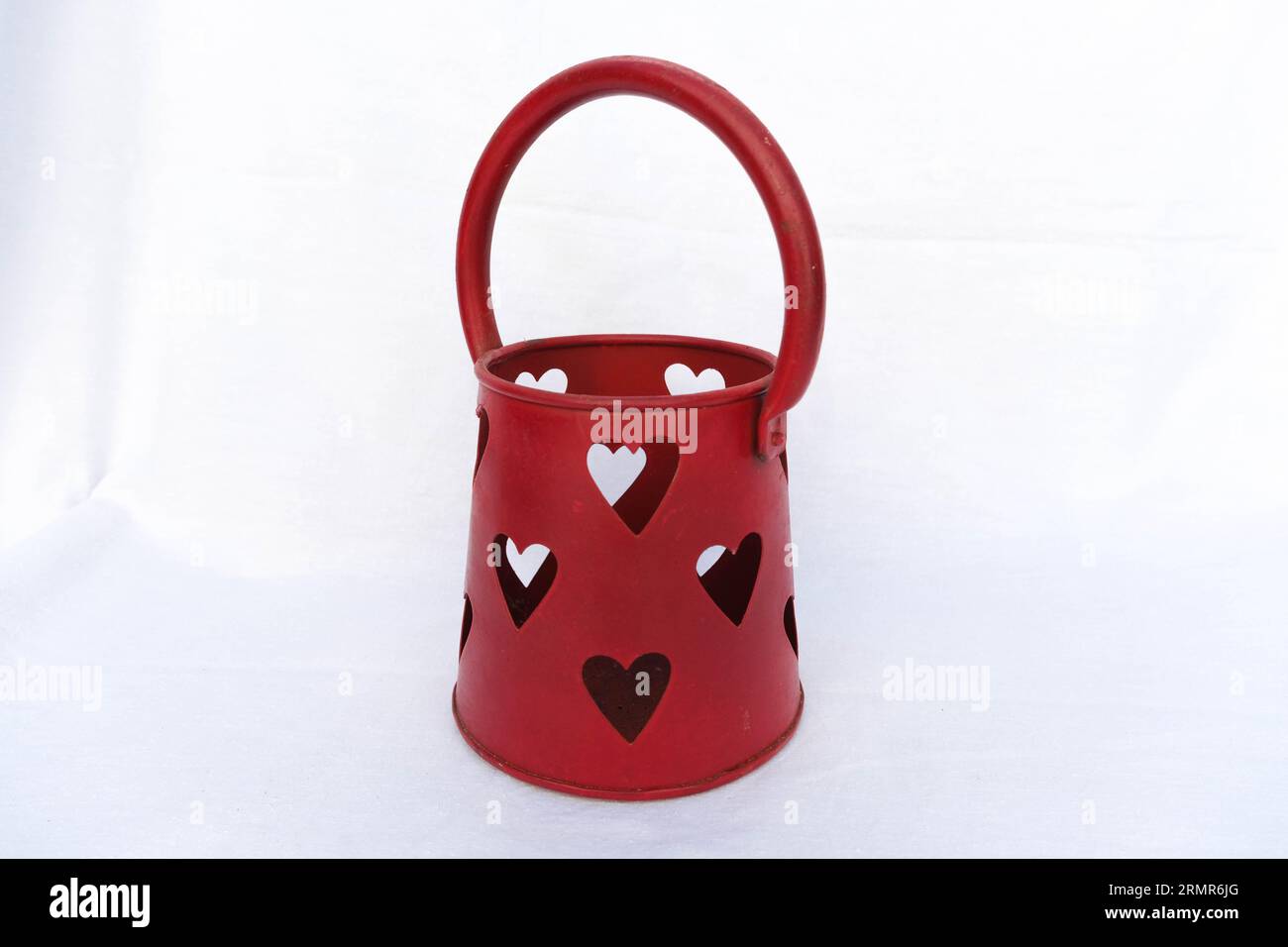 red pot with hearts and handle Stock Photo - Alamy
