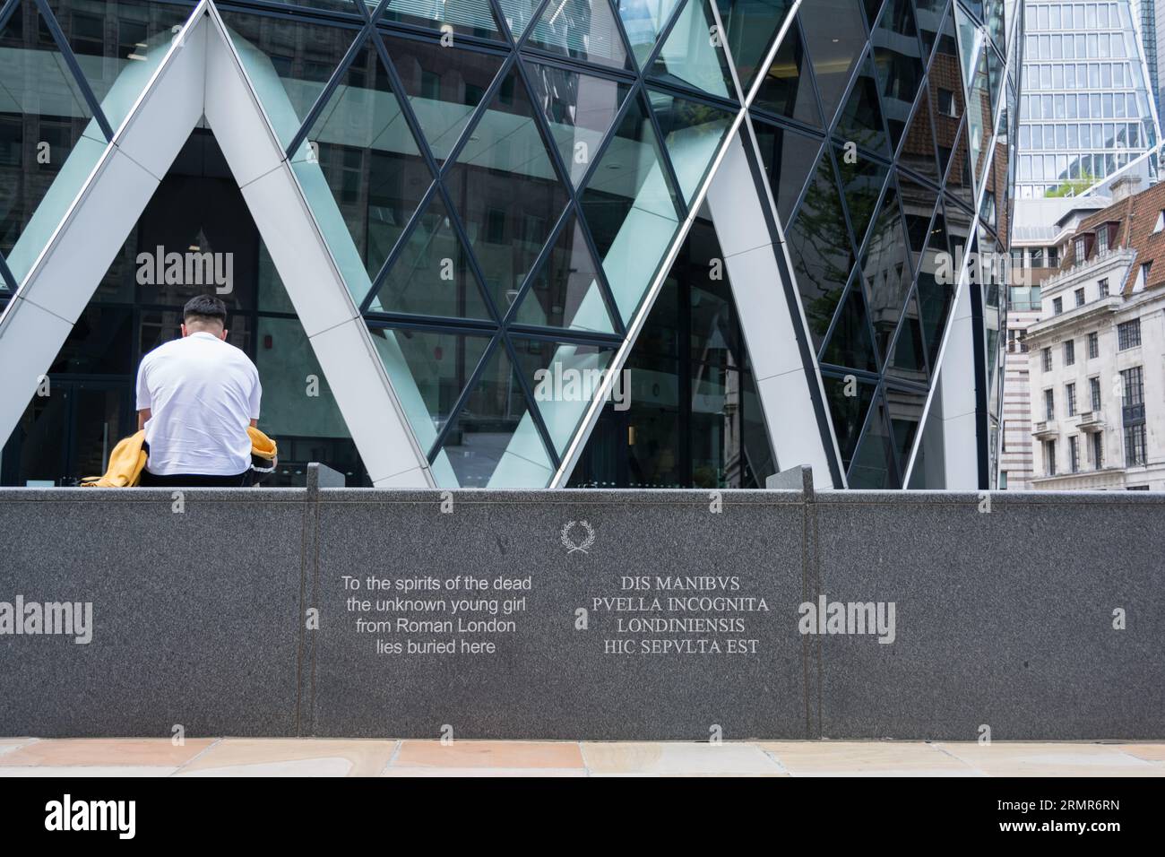 A solitary man sits under the Gherkin building - To the spirits of the ...