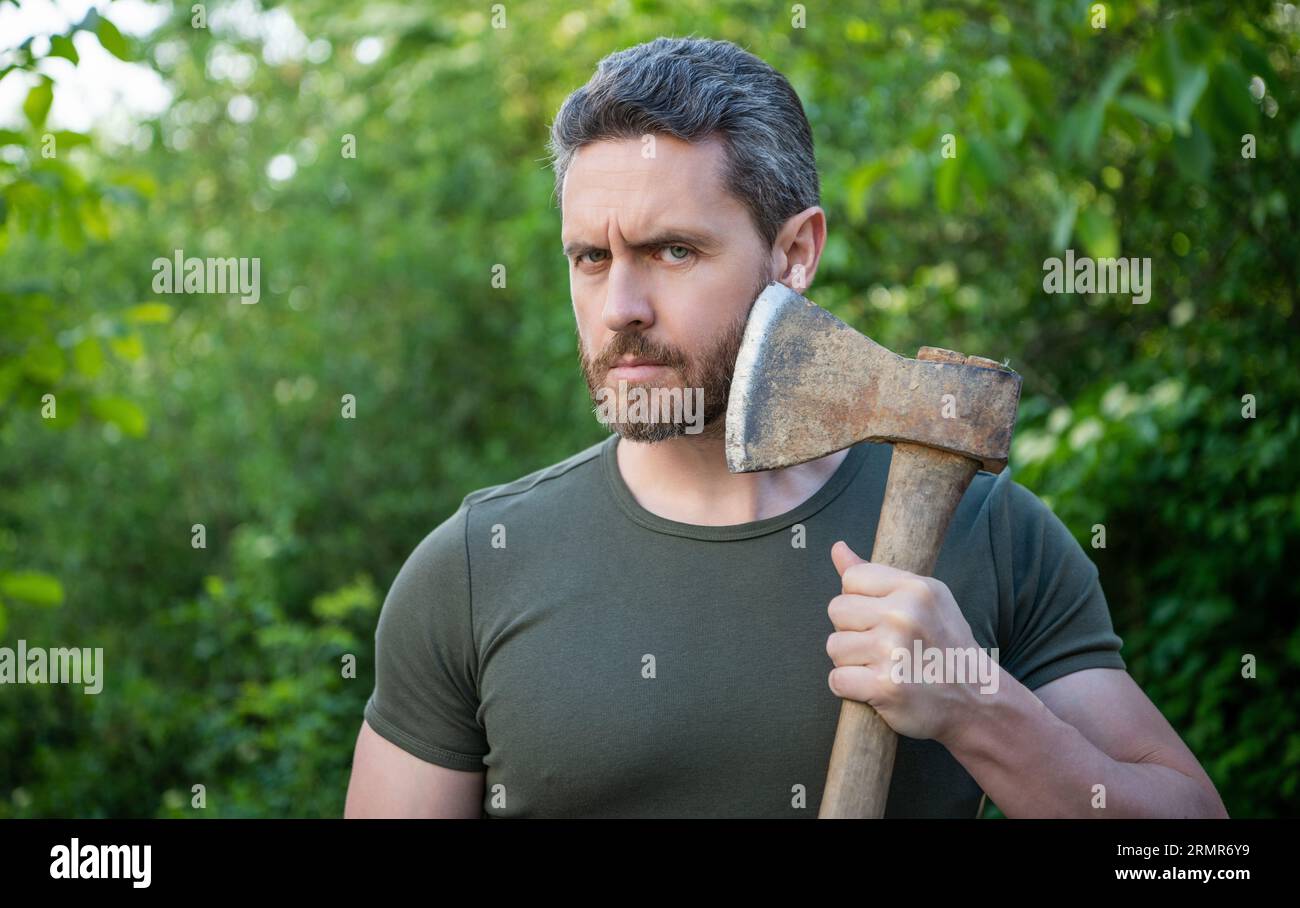 masculine guy with axe outdoor. photo of masculine guy with axe outside ...