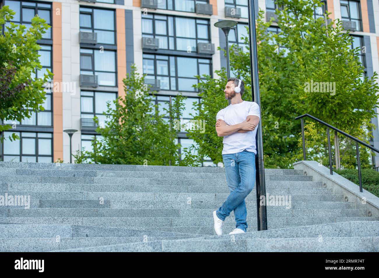 photo of man in listen music in headphones, advertisement. man in ...