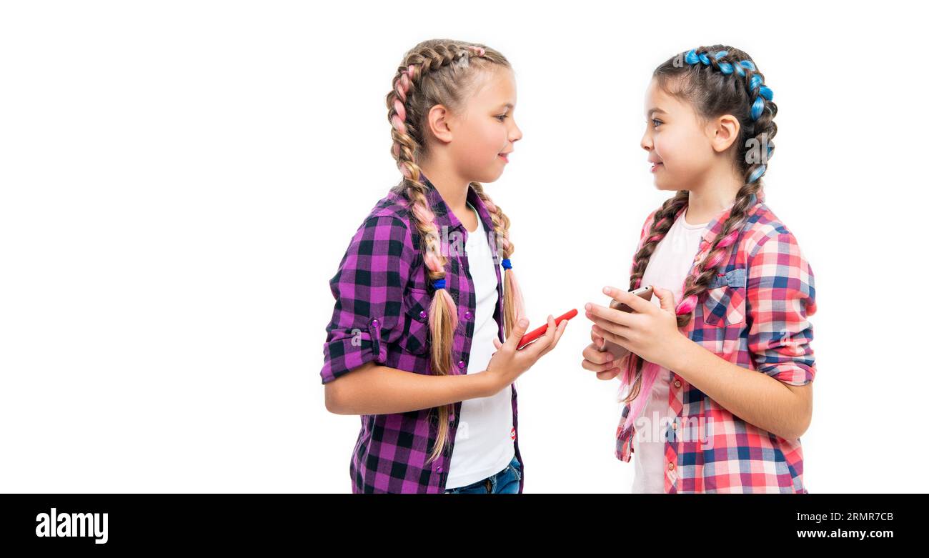 two girls chatting on phone. girls children engaged in lively ...