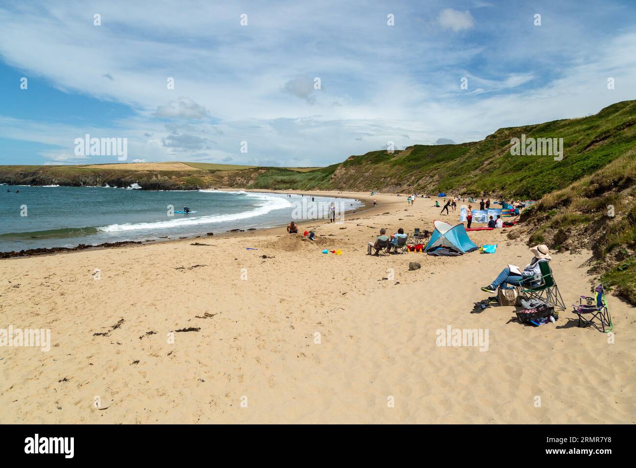 Holidaymakers enjoying sunny weather on Traeth Porthor beach, llyn ...
