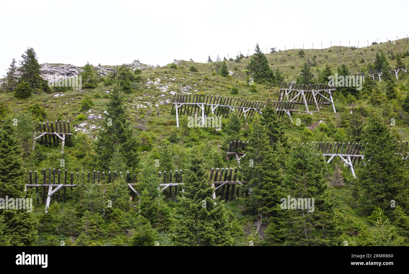 Avalanche barriers old style in the north of Italy Stock Photo - Alamy