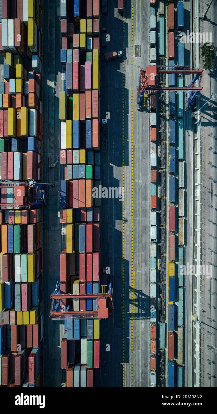 Stacked cargo containers top down aerial view. Containers at logistics terminal. Cargo container ...