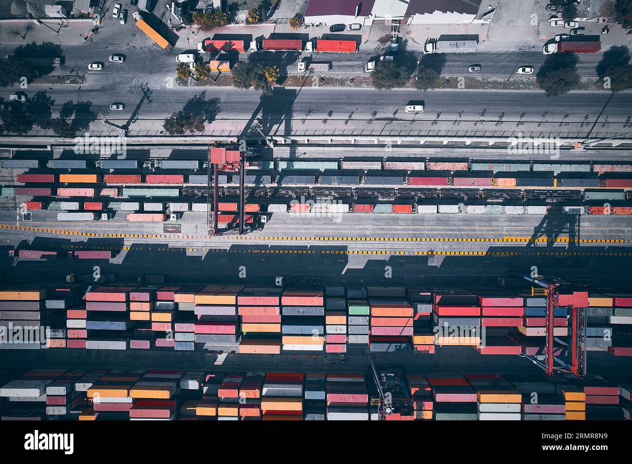 Stacked cargo containers top down aerial view. Containers at logistics terminal. Cargo container ...