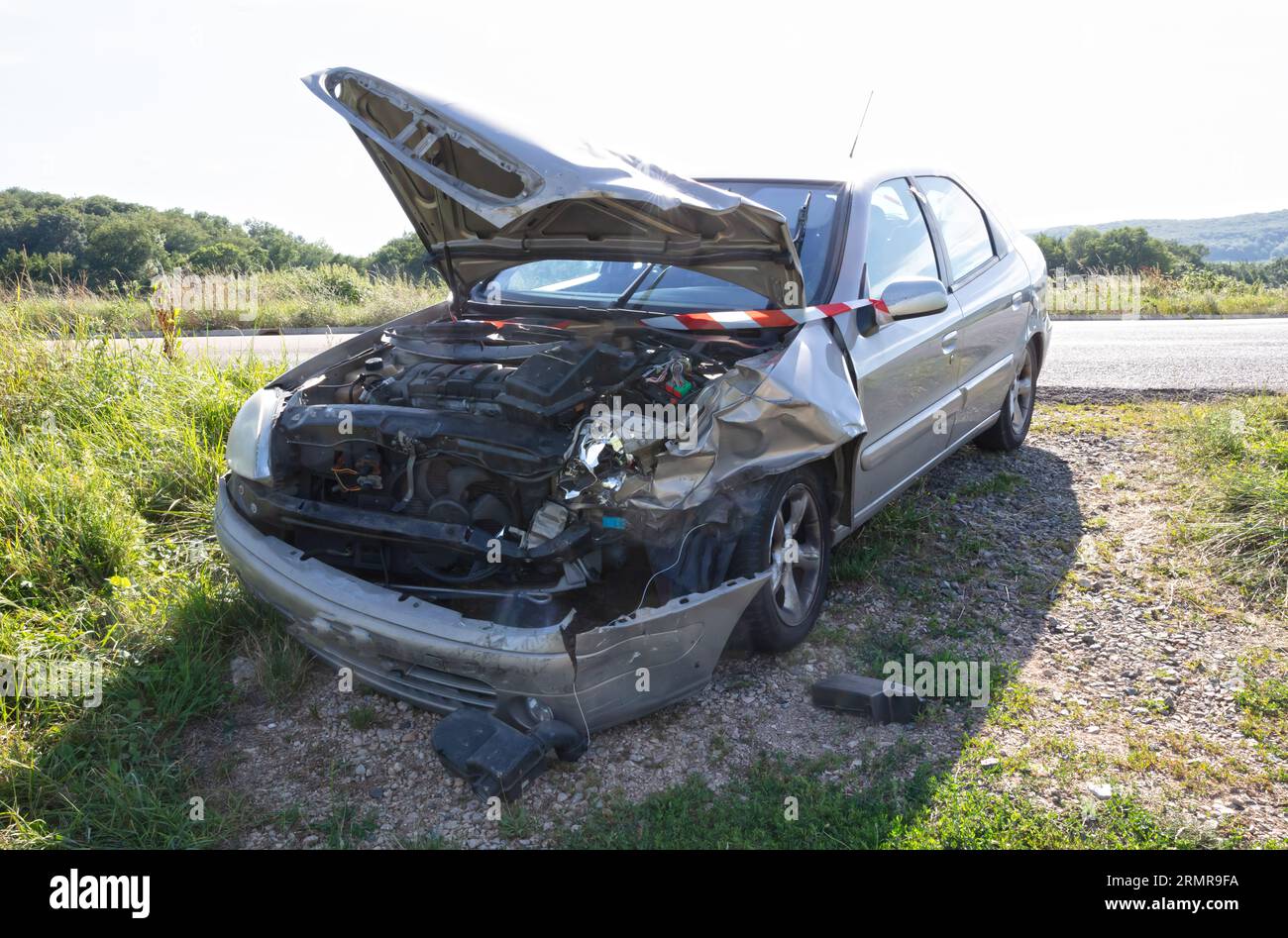 Silver car after a crash accident with an open hood, France Stock Photo ...