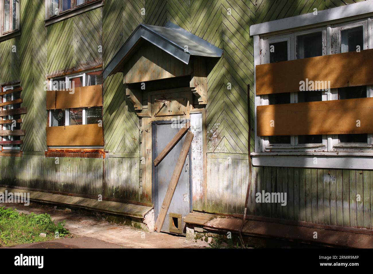 Boarded up outside windows and doors of an old residential building ...