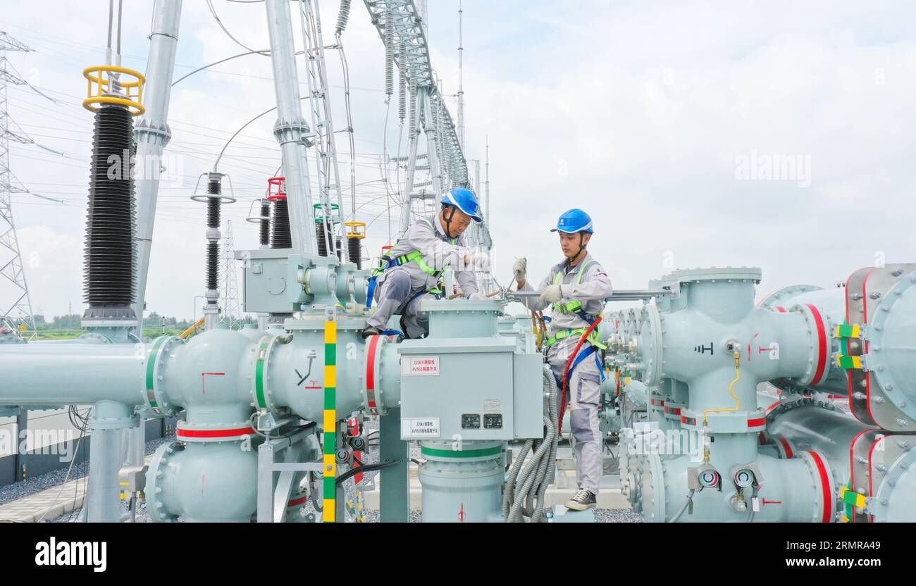 CHUZHOU, CHINA - AUGUST 29, 2023 - Power construction workers install ...