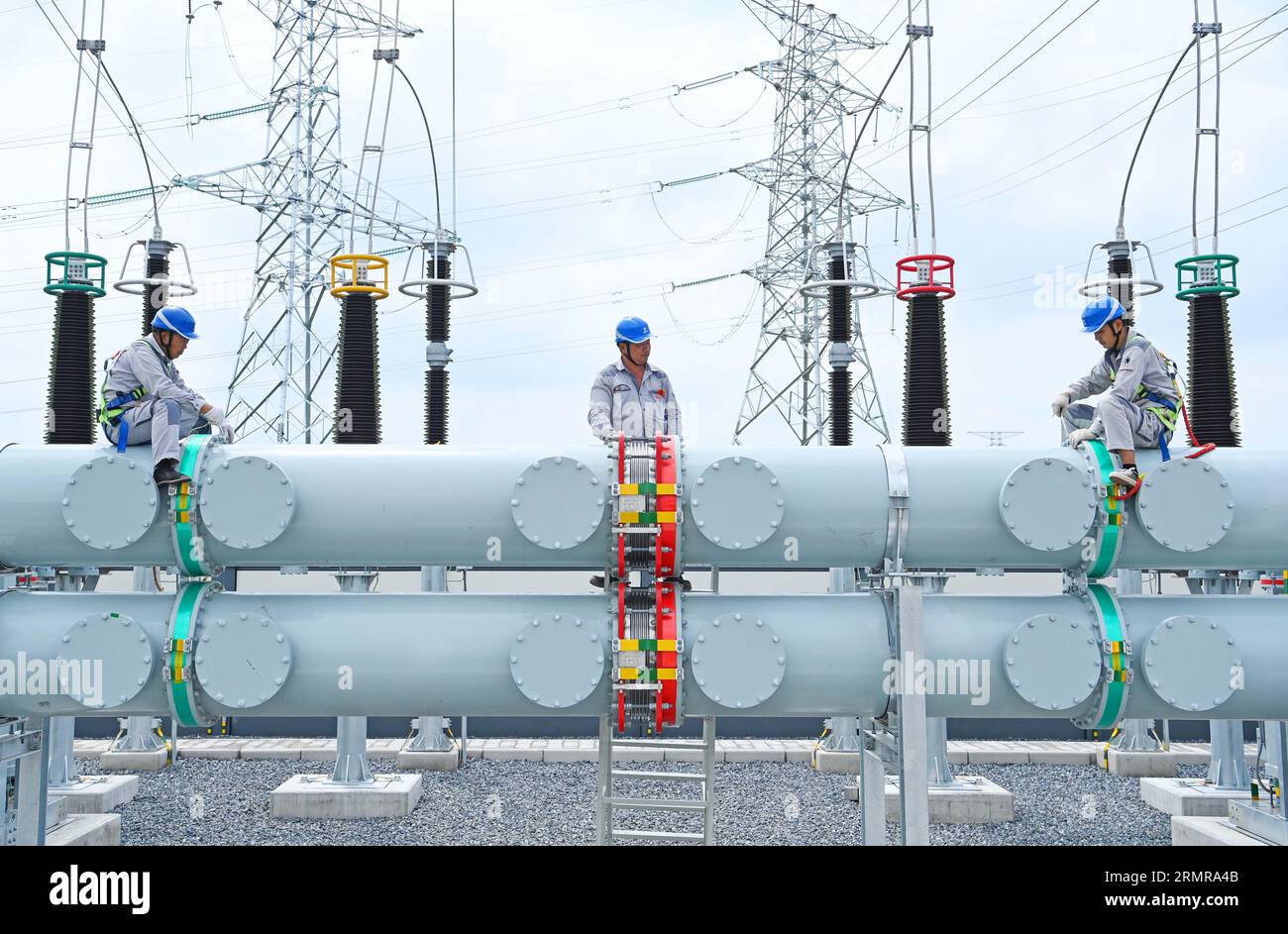 CHUZHOU, CHINA - AUGUST 29, 2023 - Power construction workers install ...