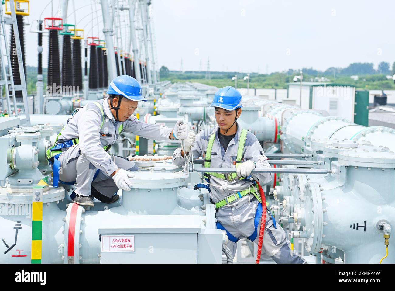 CHUZHOU, CHINA - AUGUST 29, 2023 - Power construction workers install ...
