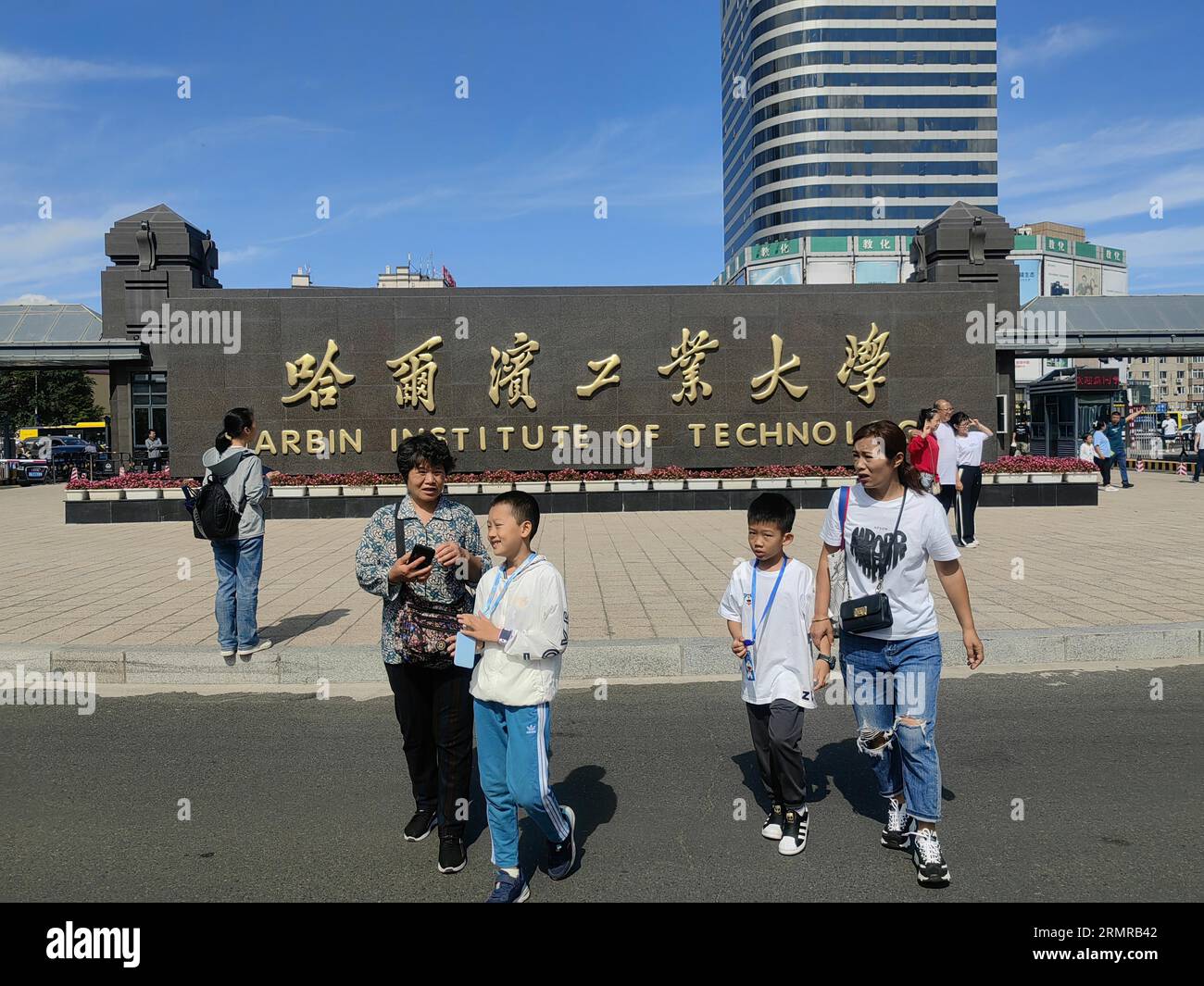 People visit the campus of the Harbin Institute of Technology in Harbin City, northeast China's ...