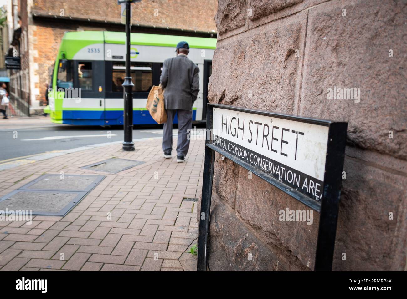 CROYDON, LONDON- AUGUST 29, 2023: High Street street signn and tram in ...