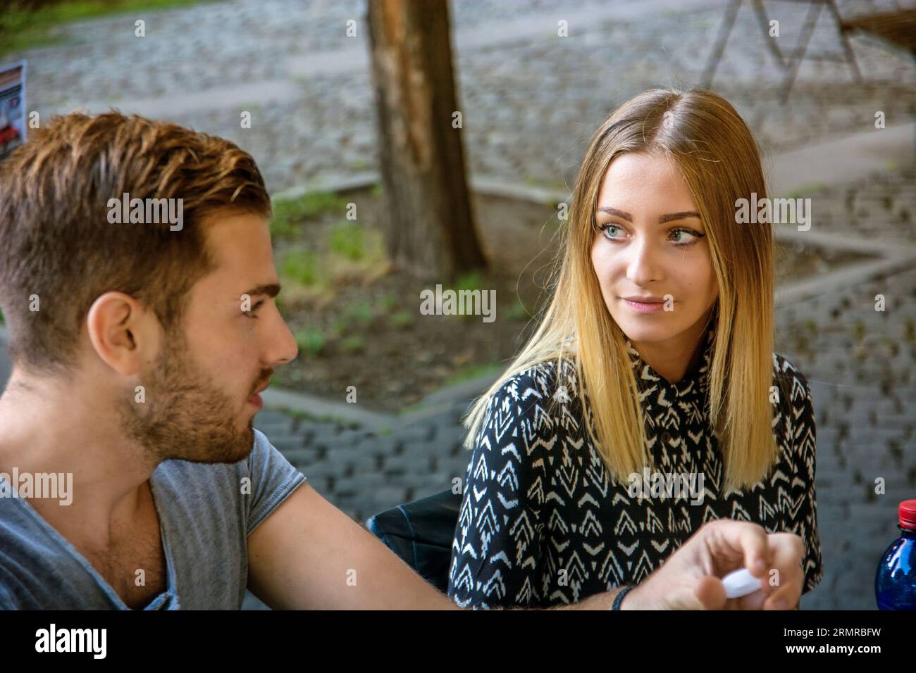 Woman sitting table socializing hi-res stock photography and images - Alamy