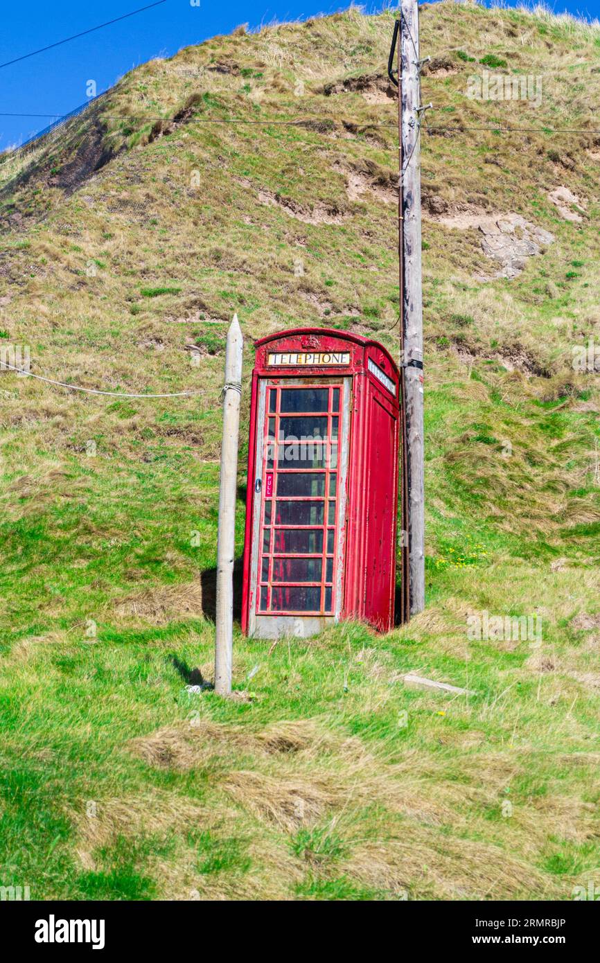 Iconic Traditional British Red Telephone Box, set up on the hillside in ...