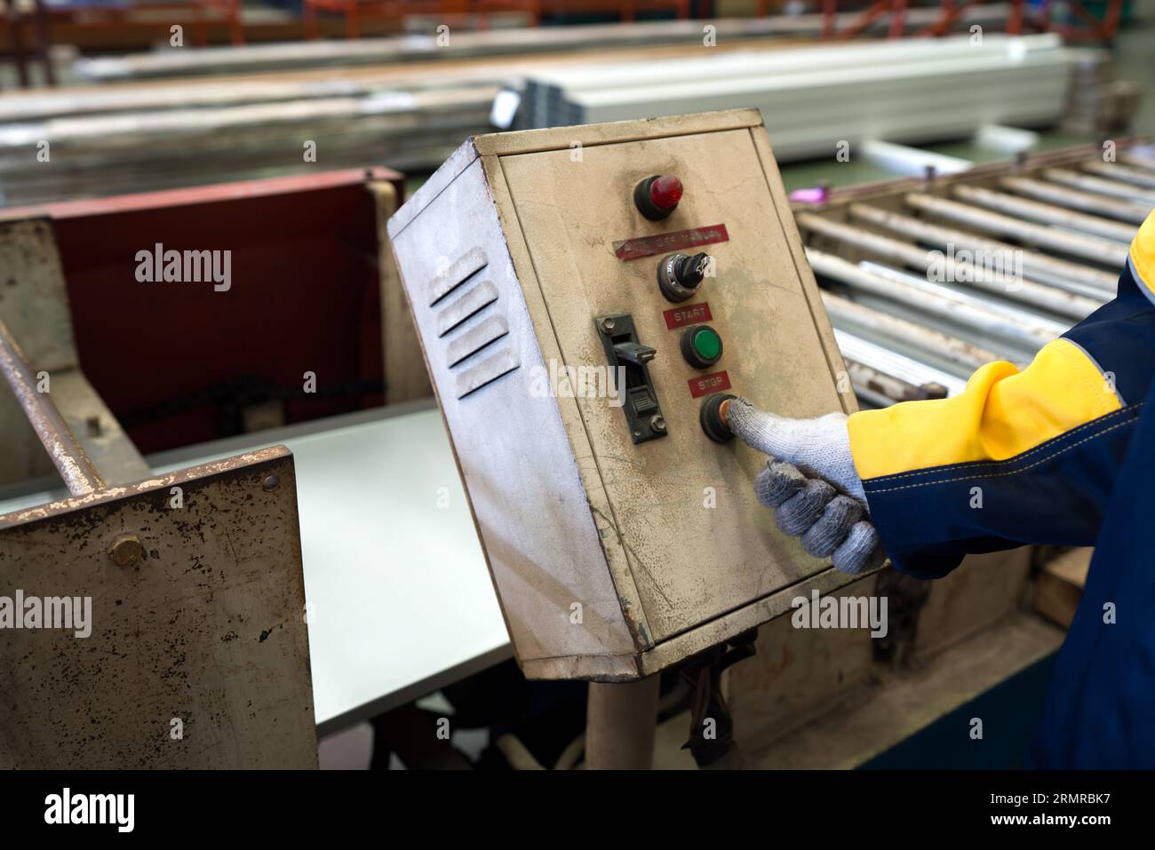 A tireless worker, diligently operates an intricate contraption within ...