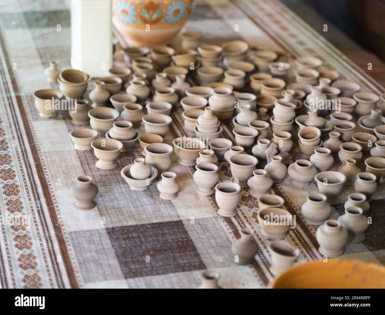 market or warehouse of ceramic small vessel on pottery wheel ...