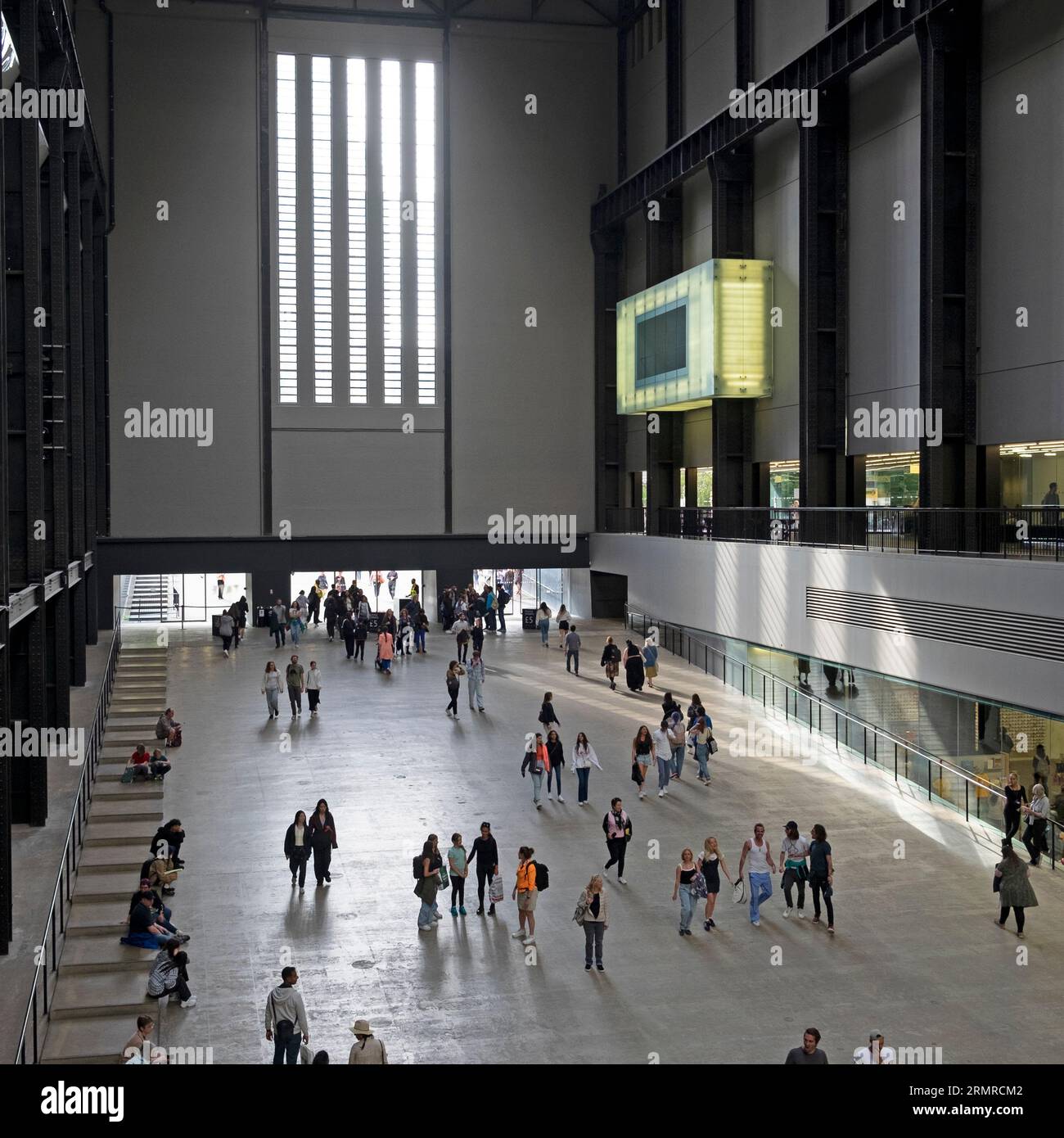 Vertical view of people inside the Turbine Hall Tate Modern Art Gallery ...