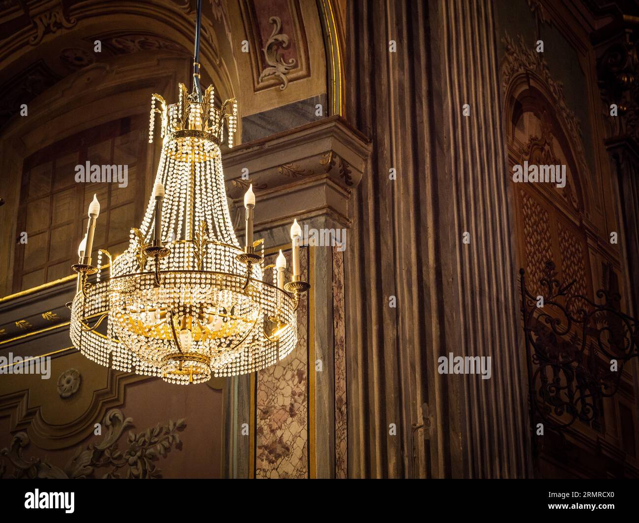 A chandelier hanging from the ceiling of a building. Photo of a ...