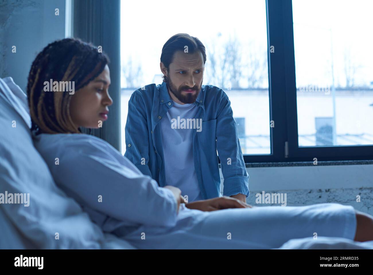Miscarriage Man Sitting Near Depressed African American Woman Blur