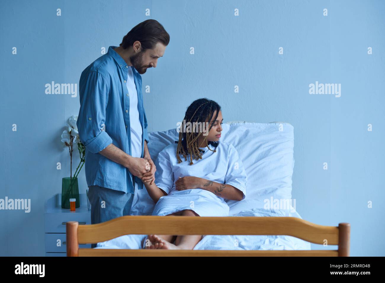 Miscarriage Concept Man Holding Hands Of African American Wife