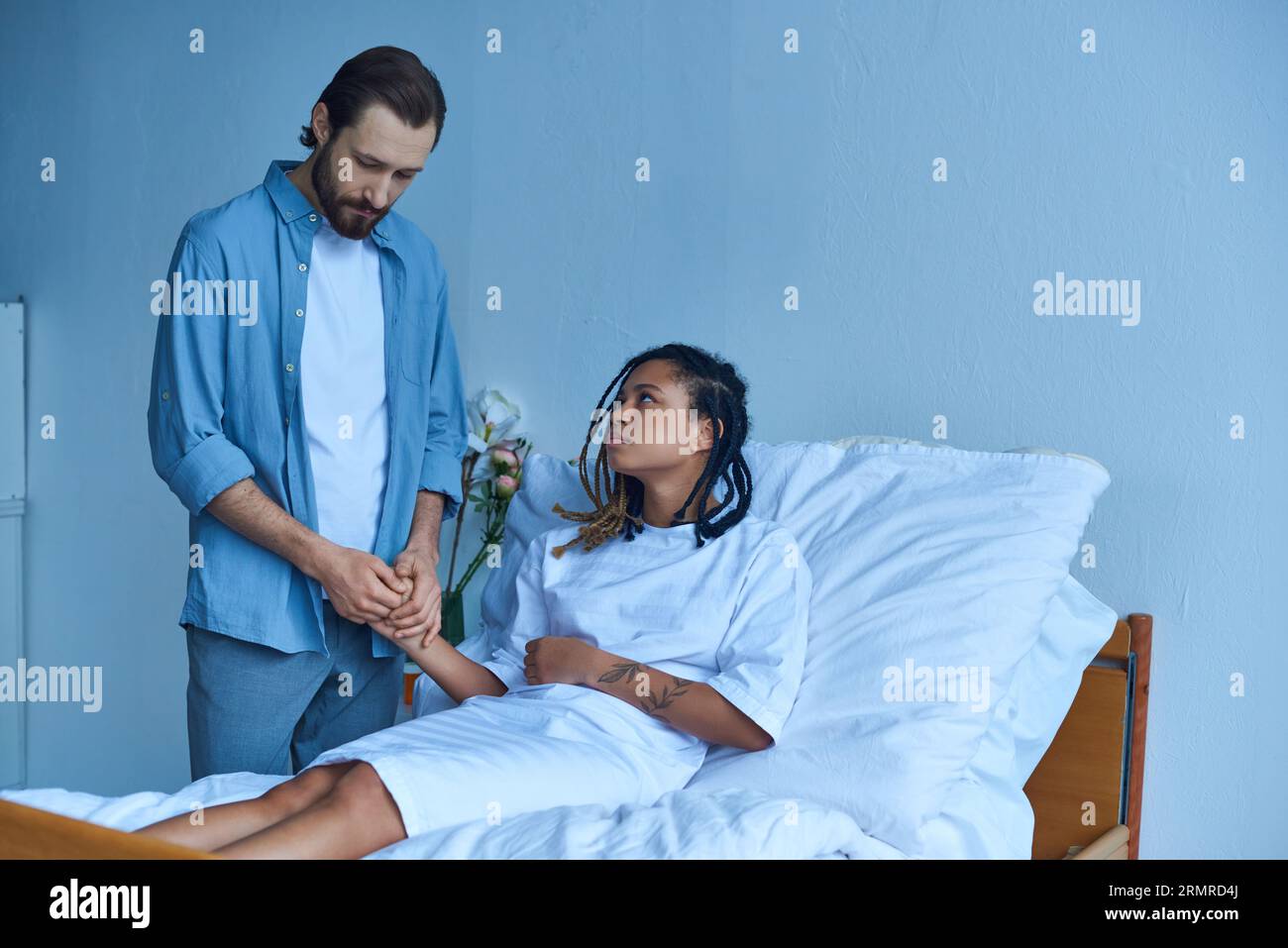 Miscarriage Concept Man Holding Hand Of Depressed African American