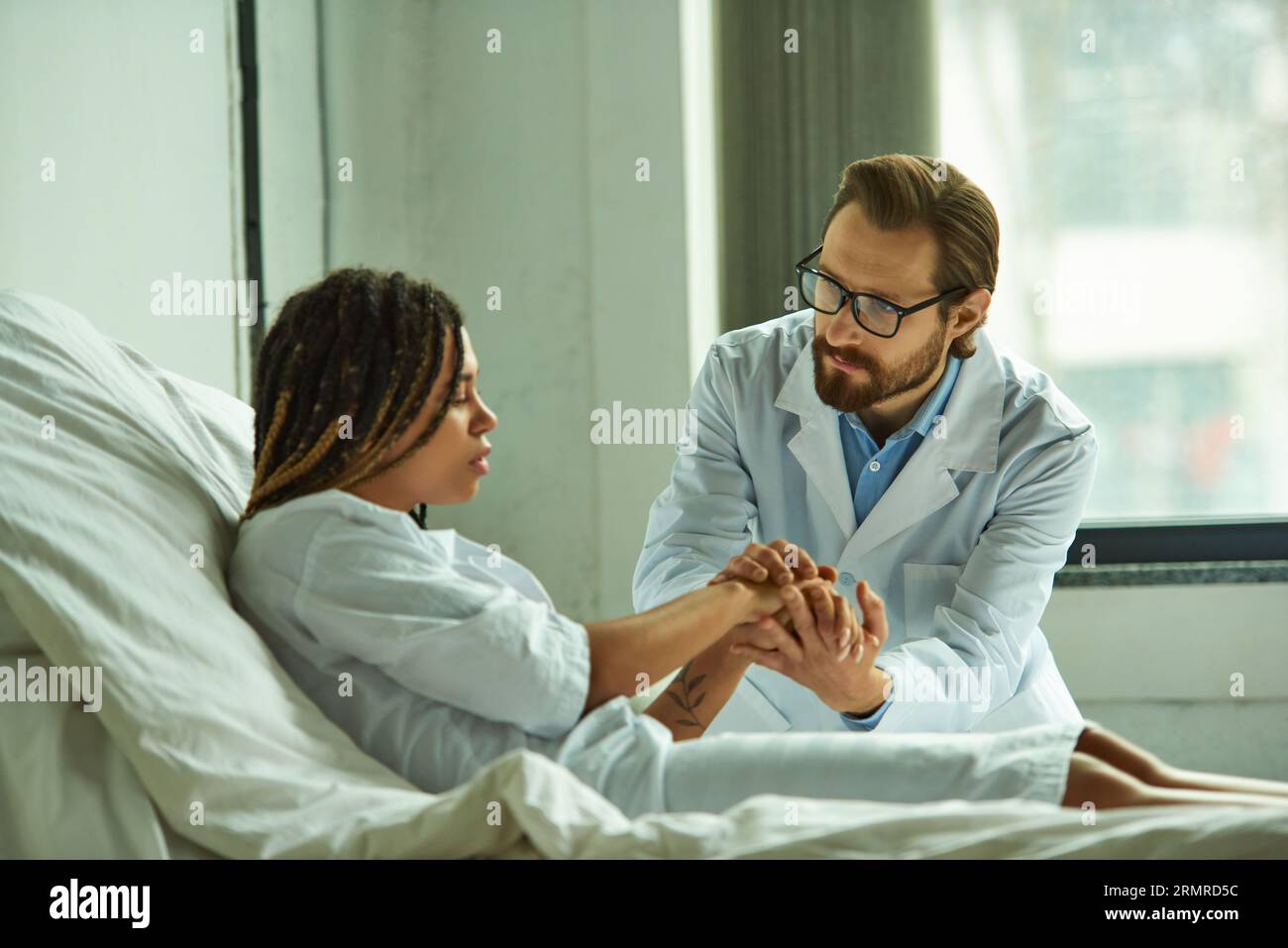 Sad woman doctor empathy hi-res stock photography and images - Alamy